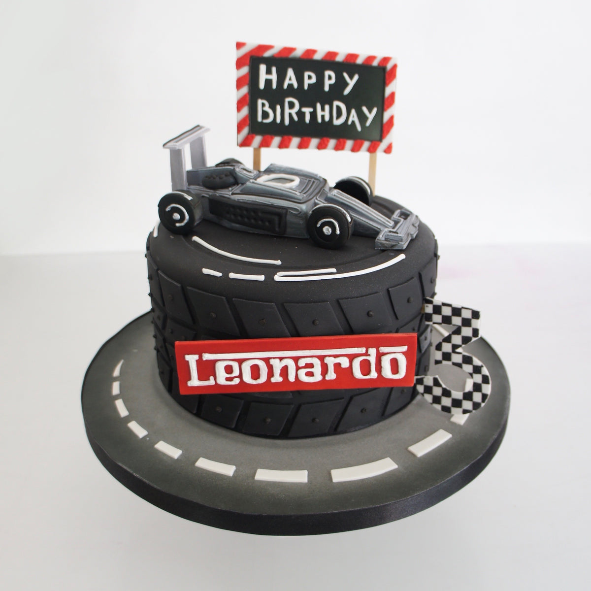 Formula one car tyre cake – Tuck Box Cakes